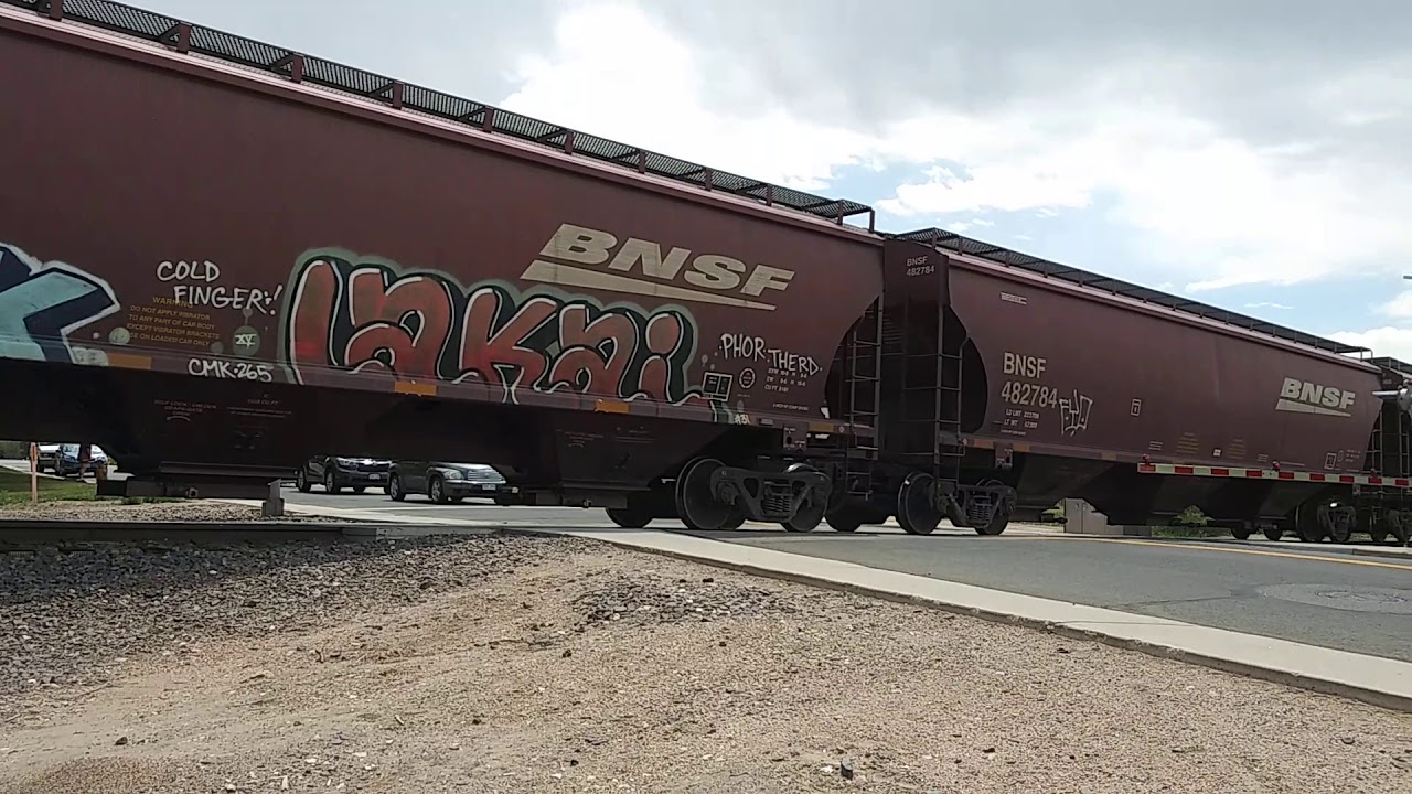 BNSF C44-9W #5028 & BNSF SD70ACe #9399 lead the H-DENLAU northbound manifest freight train ...
