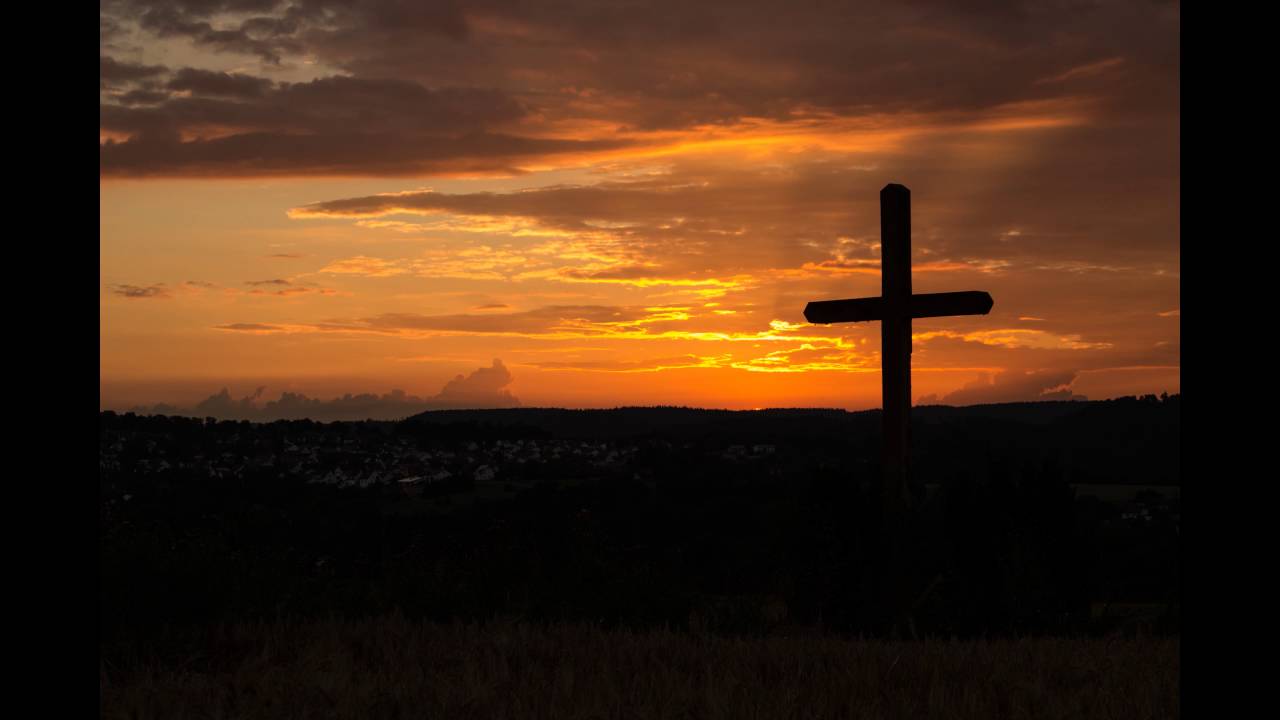 Timelapse wooden cross in front of a sunset - YouTube