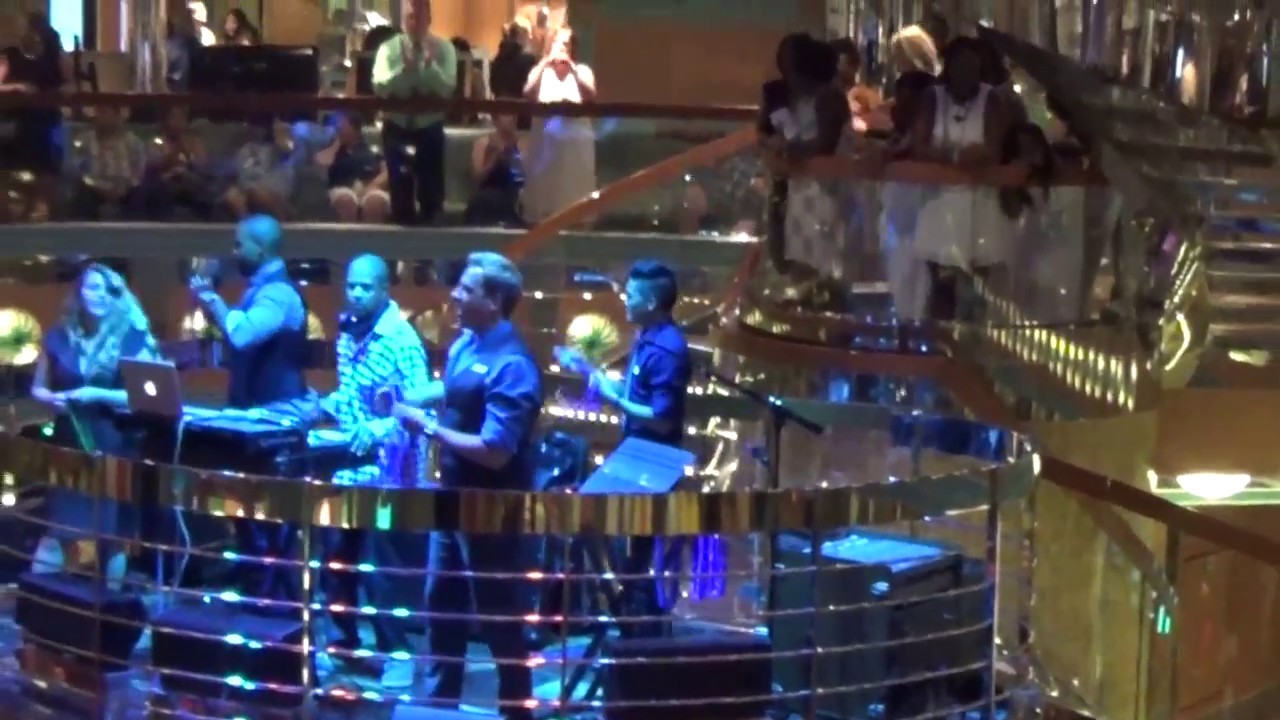 Carnival Magic party in the lobby with Reverend Dr E. - YouTube