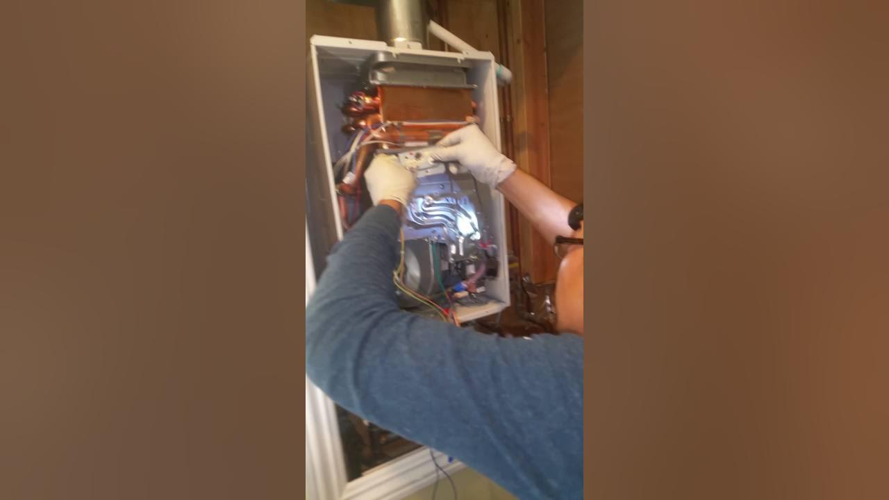 Takagi Tankless Water heater leaking heat exchanger replacement - YouTube