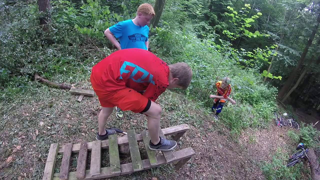 Building A DH trail 2 (wooden drop off) - YouTube