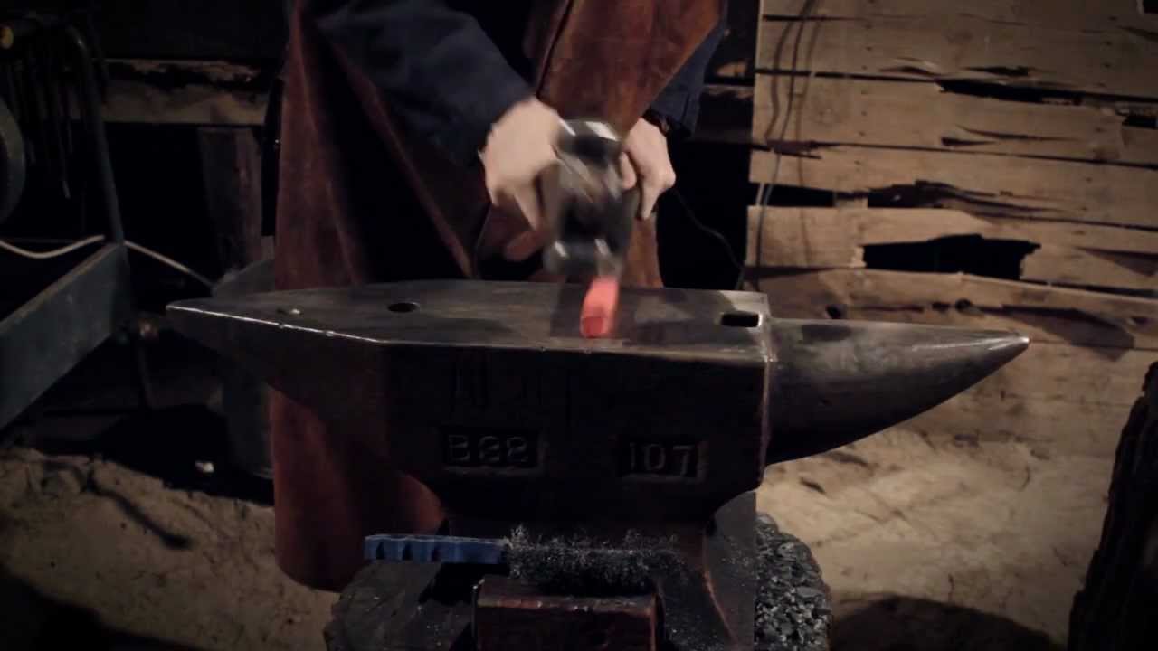 forging a hammer-eye-punch - YouTube