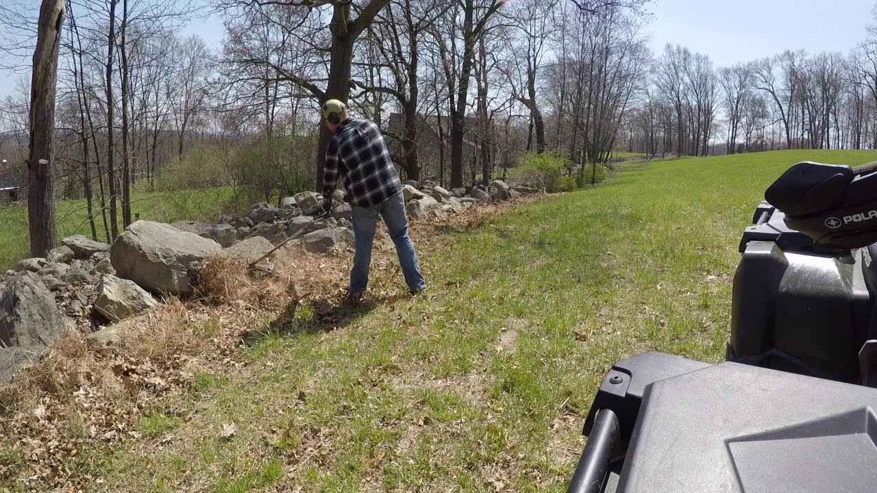 Clearing hay field stone rows - YouTube