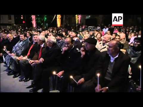 Christians in the West Bank light large Christmas tree - YouTube