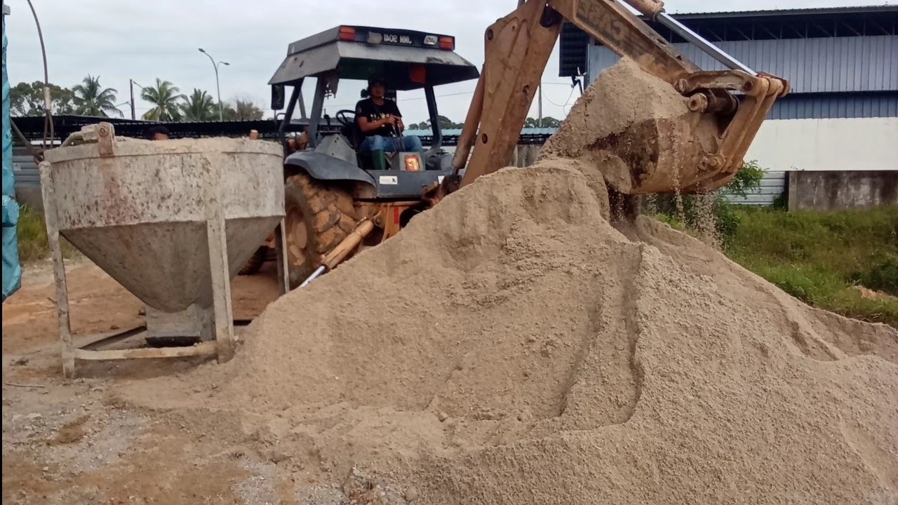 JCB and mobile crane||work together to raise sand material in apartment ...