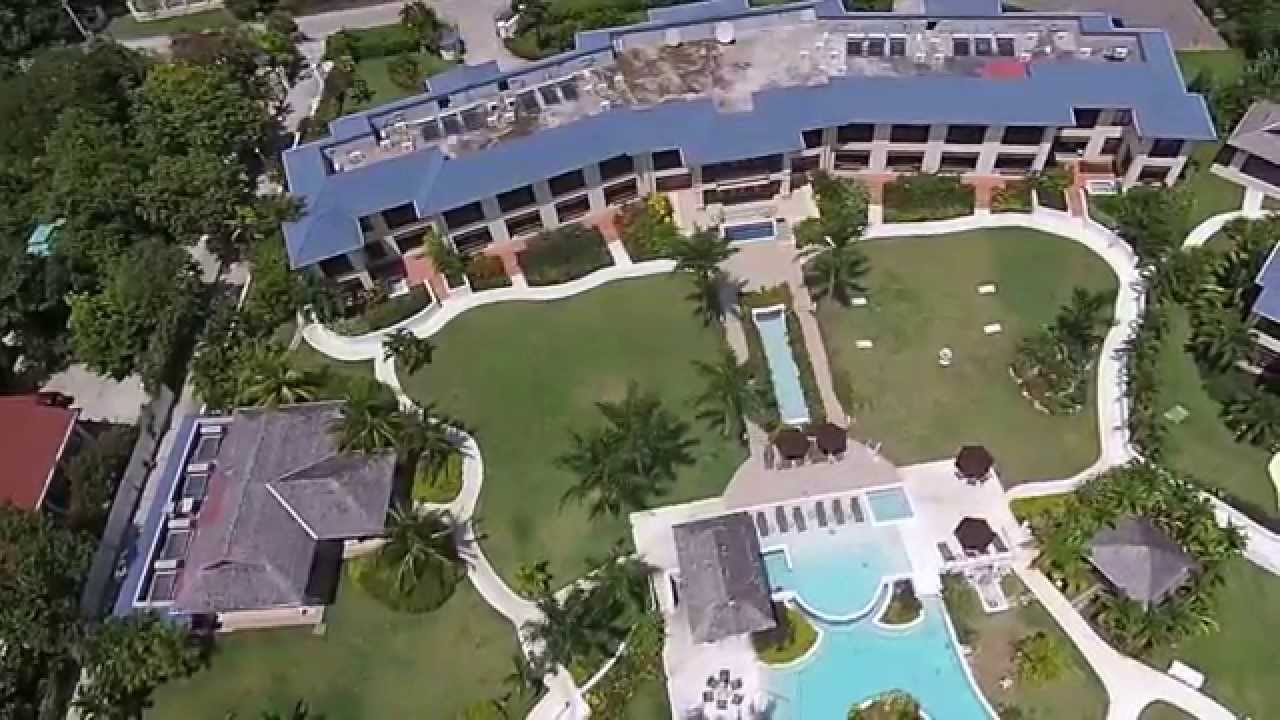 Aerial footage of Moondance Cliffs, Negril Jamaica. - YouTube