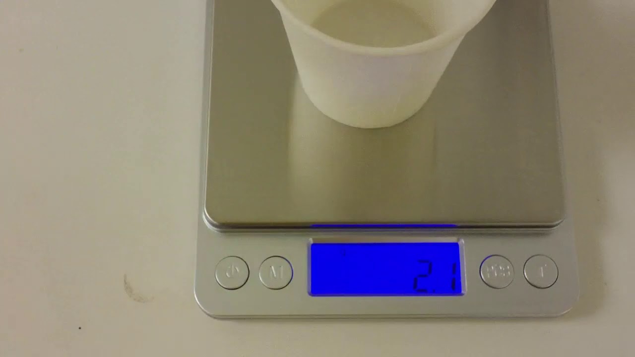 Using an electronic balance to measure a powder or granular substance ...