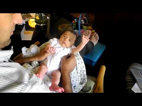 Daddy waking up baby to feed