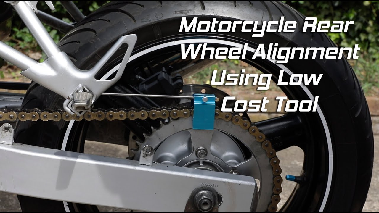Motorcycle rear wheel alignment using straight rod tool - YouTube