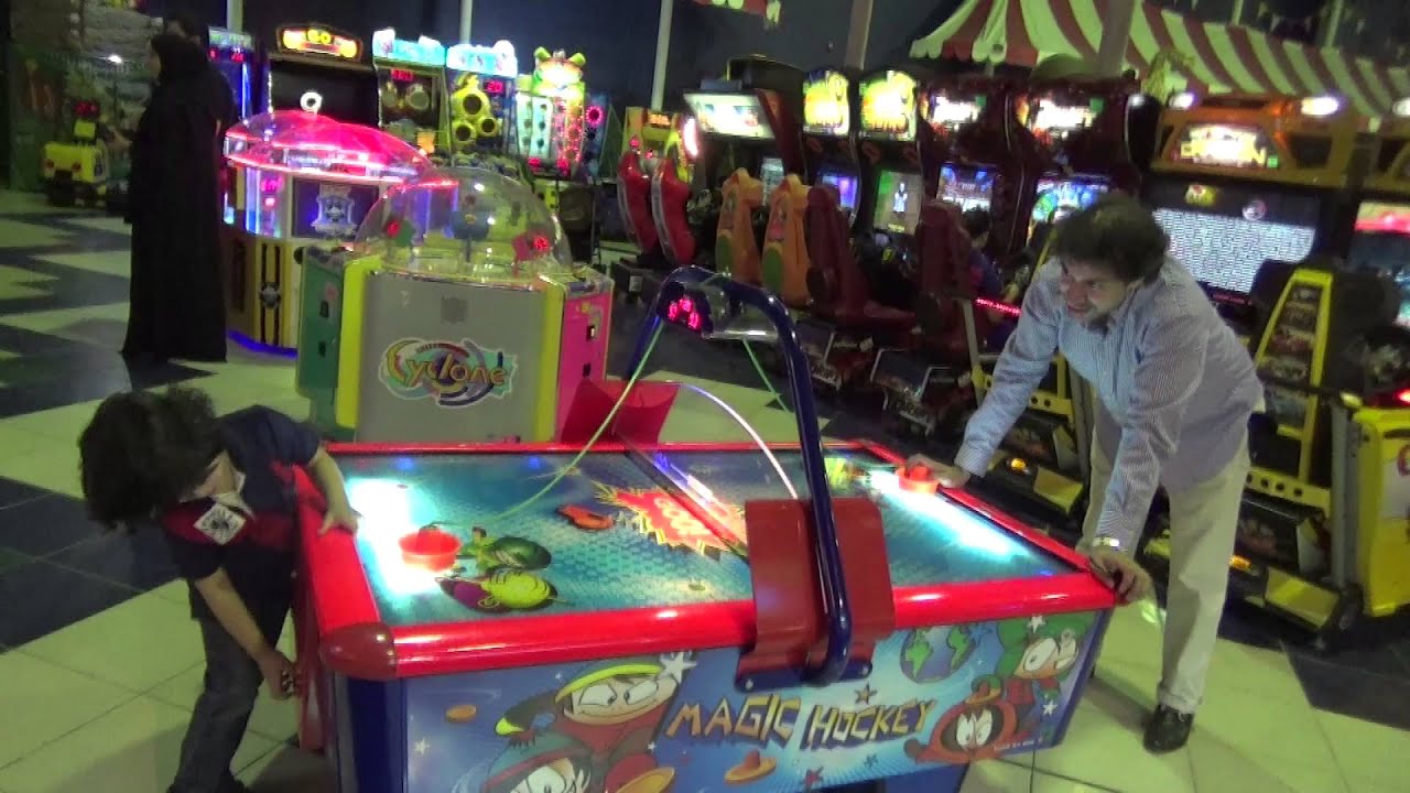 Nayef playing air hockey with daddy at circus land, doha, qatar - YouTube
