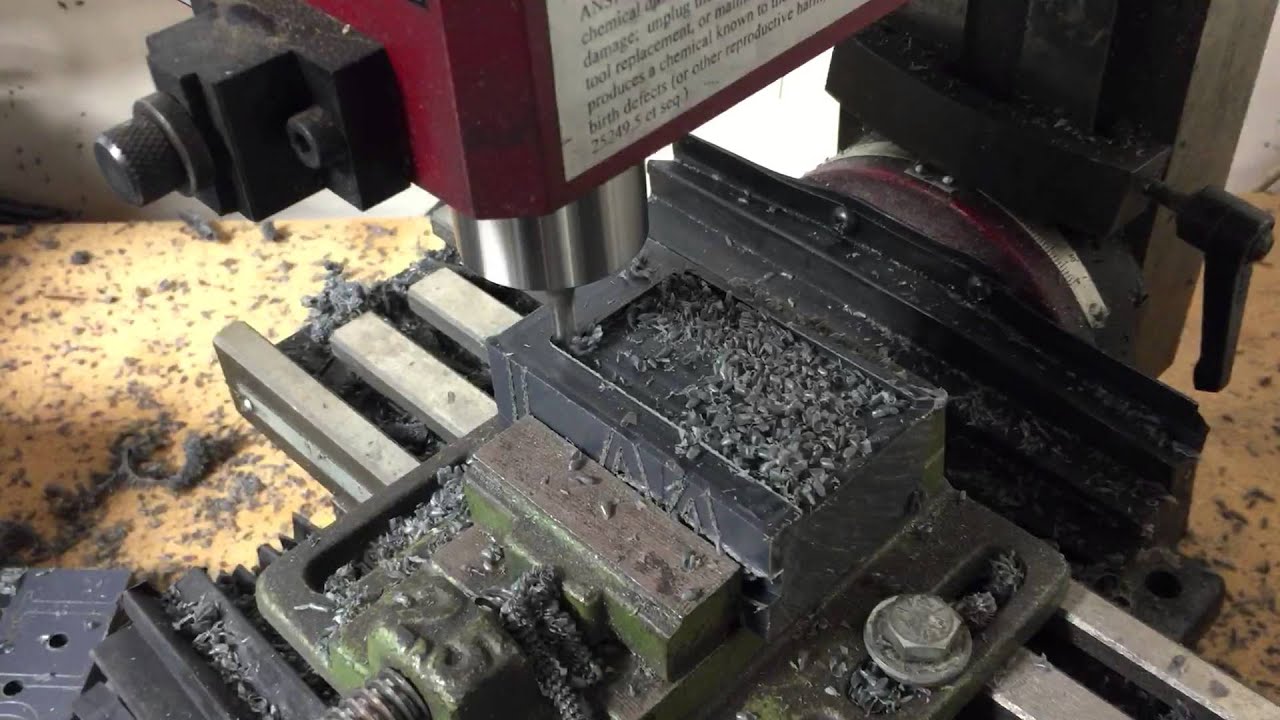 X2 CNC milling machine: surfacing graphite impregnated nylon - YouTube