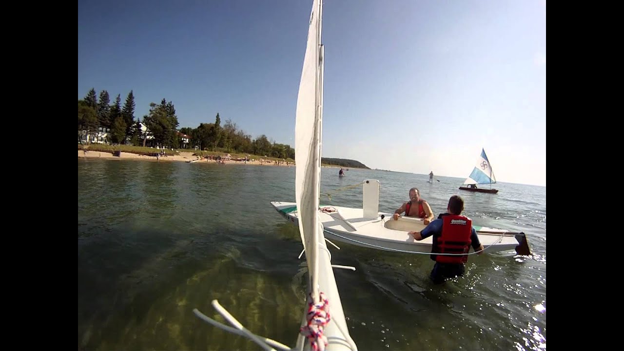 jumping off a Sunfish sailboat - YouTube