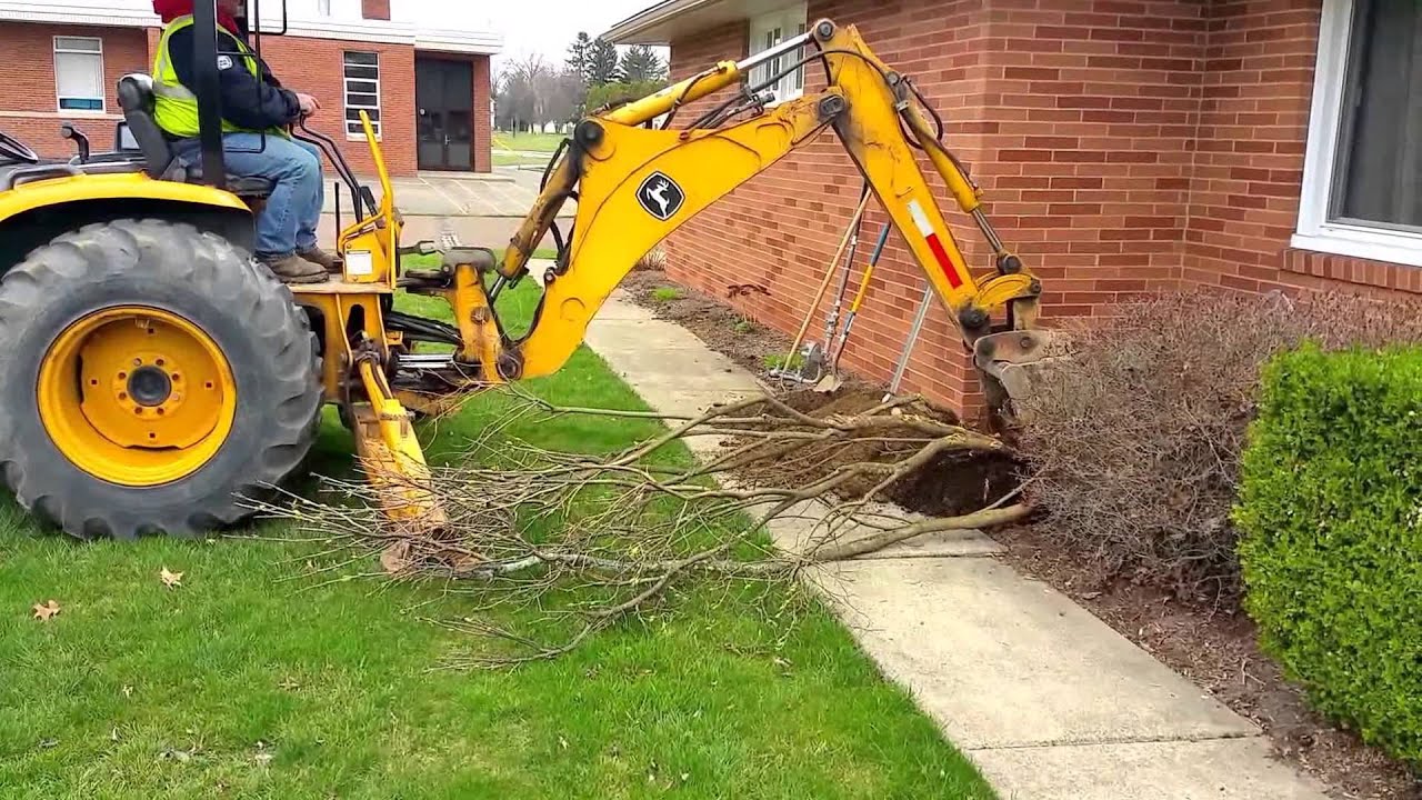 Copy of Gas line Replacement - Backhoe digging near the foundation ...