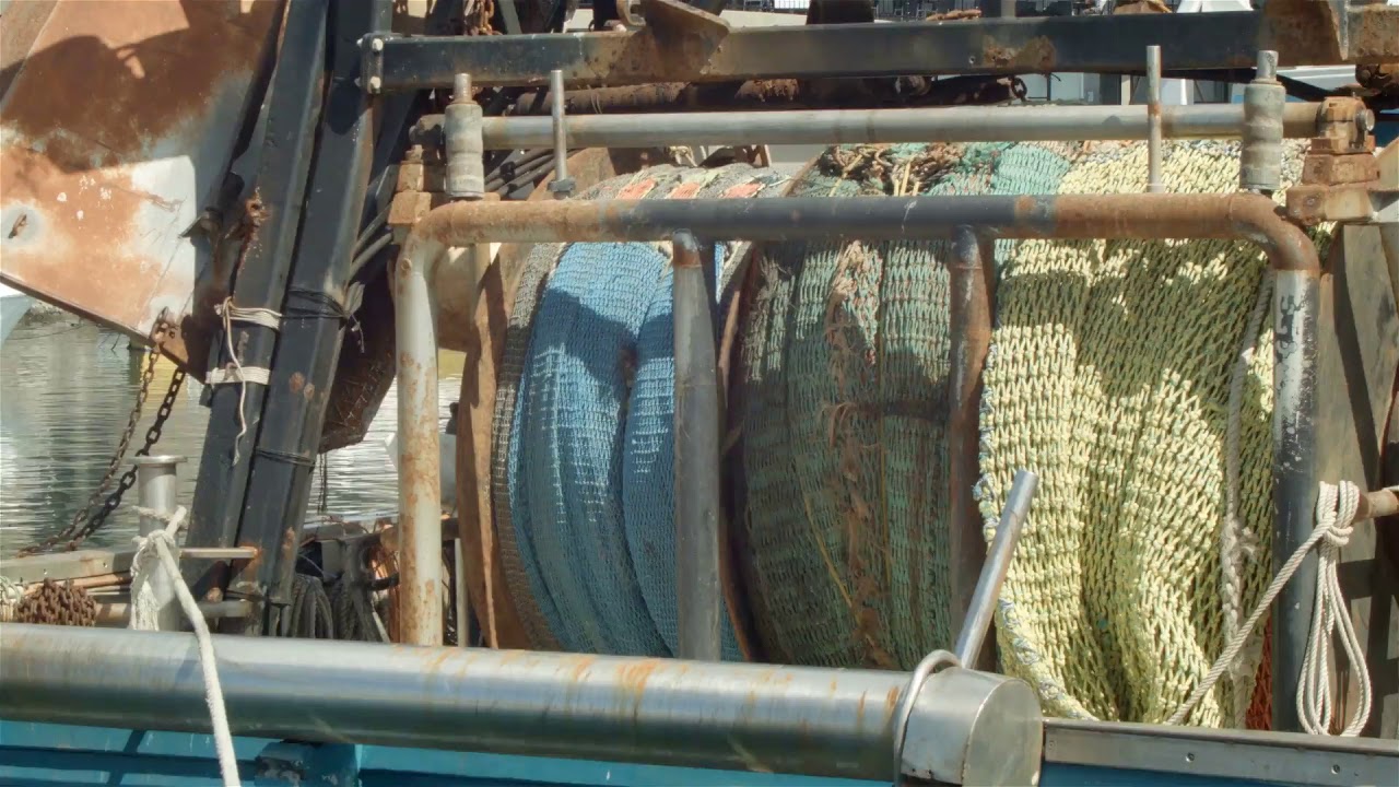 commercial fishing industry fisherman boats with fishing net waiting at ...