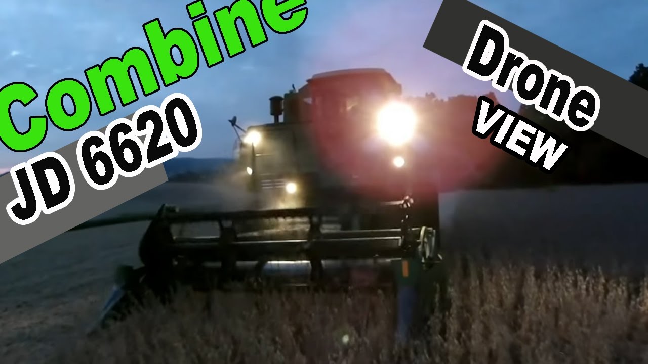 Camera Drone flying over a John Deere combine 6620 - YouTube