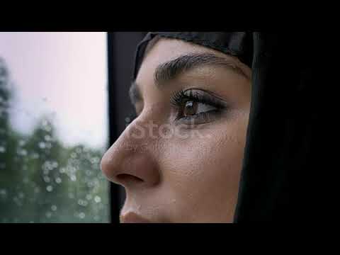 Young Muslim Womans In Hijab Eyes Is Watching In Rainy Window In Bus Weather Concept Transport Conce