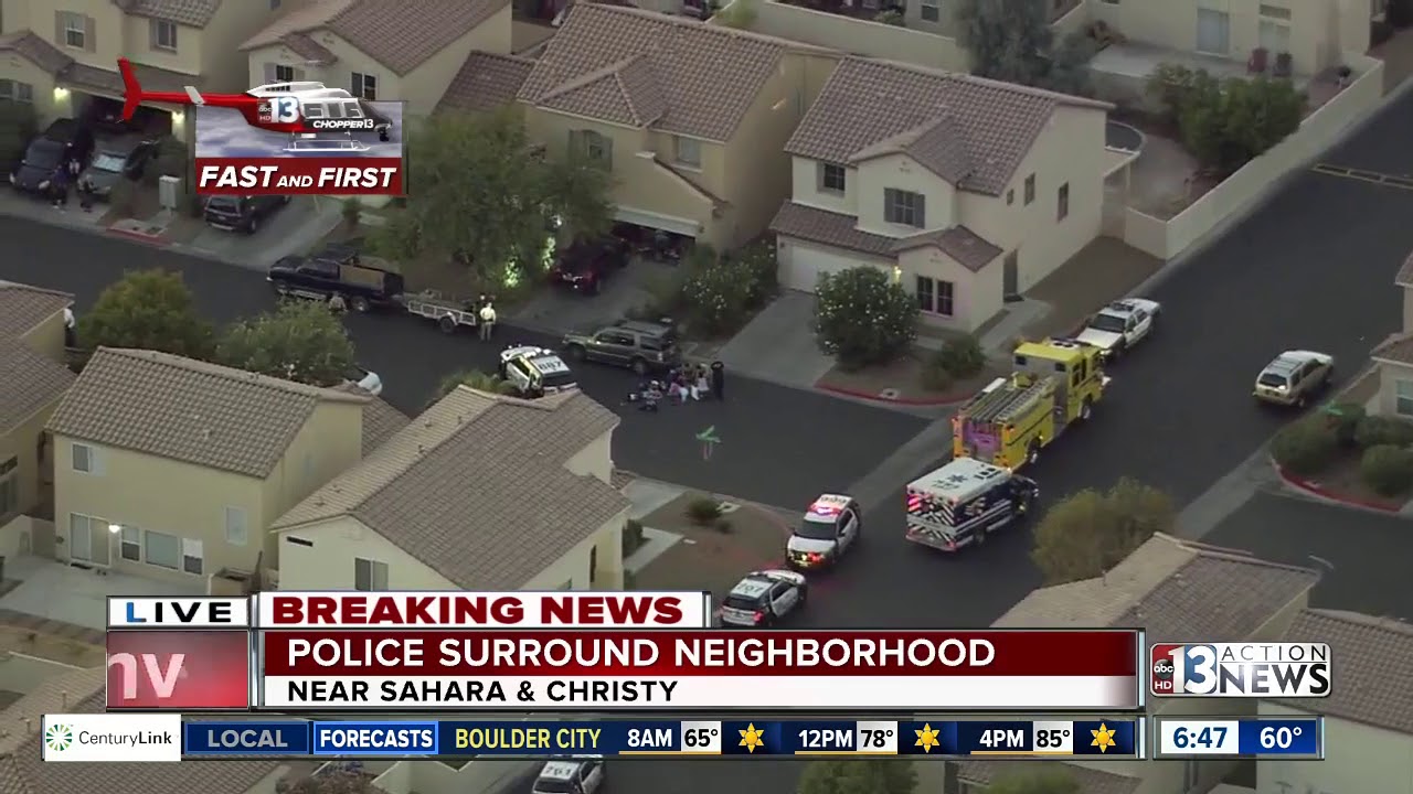 Police surround neighborhood near Sahara, Sloan - YouTube