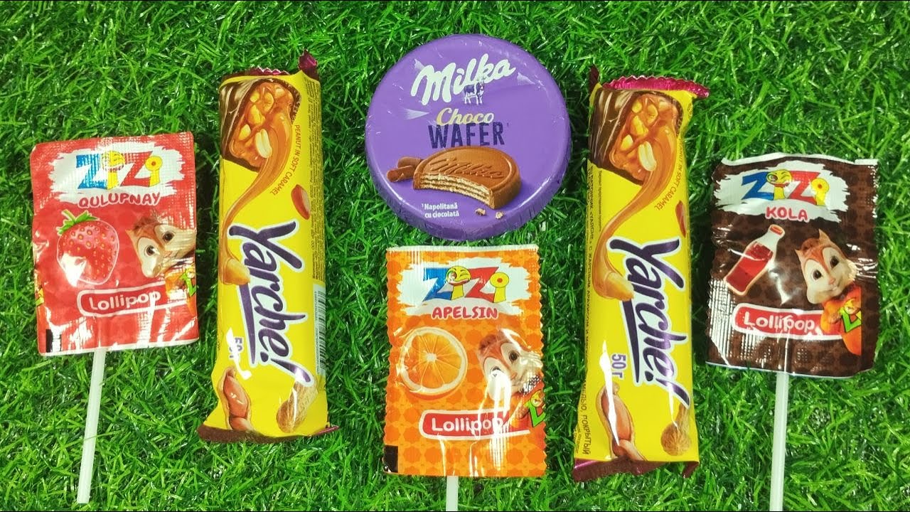 Zizi KOLA Lollipop A cola-flavored lollipop. Packed in a brown wrapper ...