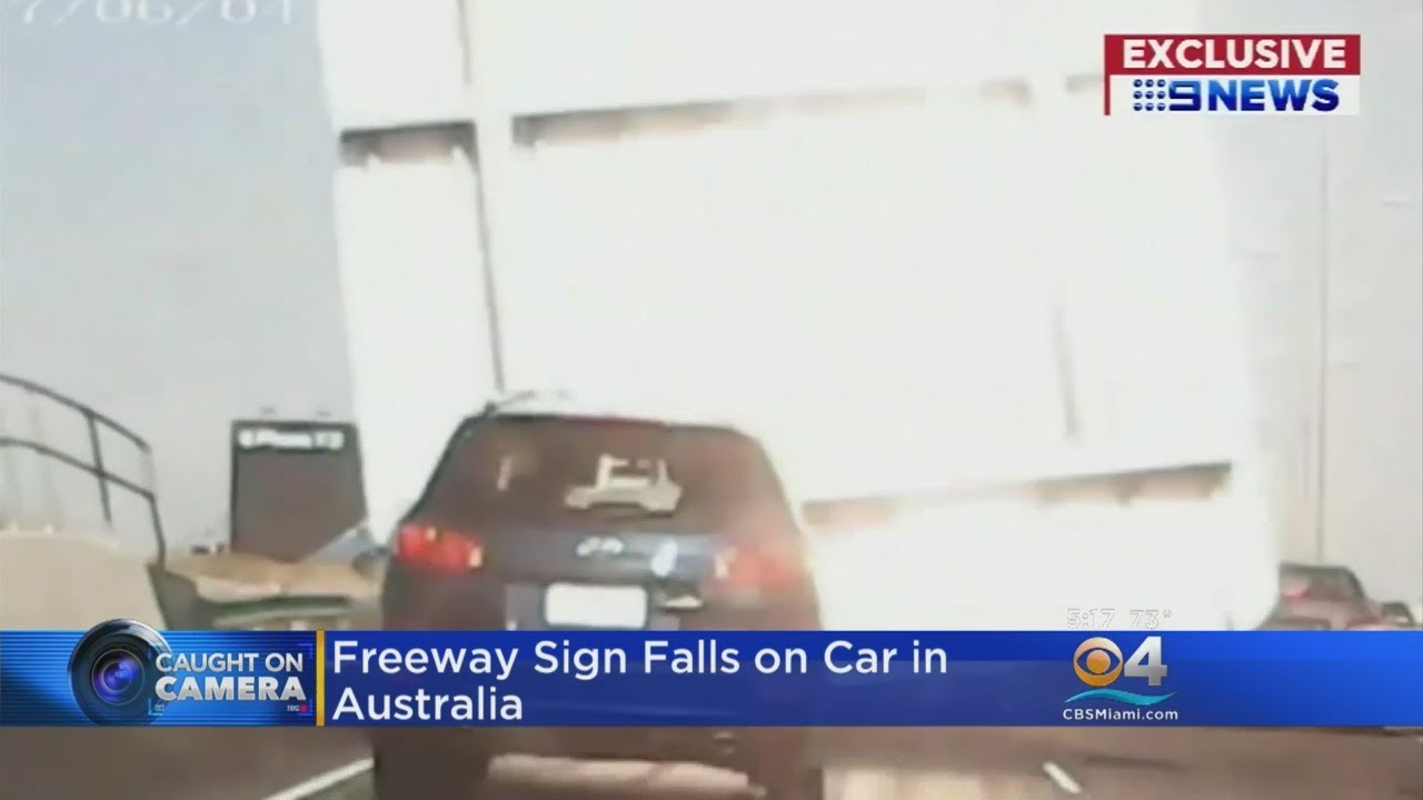 Highway Sign Suddenly Falls, Slamming Into Unsuspecting Car - YouTube