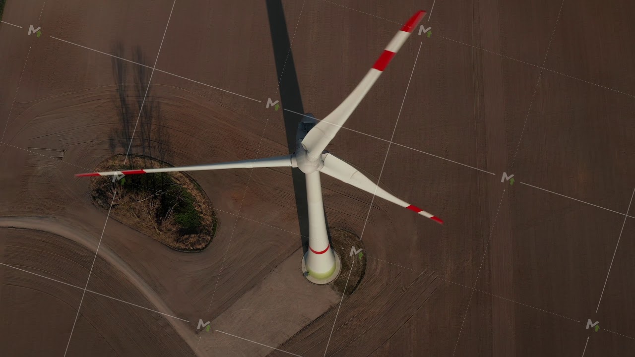 AERIAL: Close up Overhead shot of wind Turbine, Mill rotating by the ...