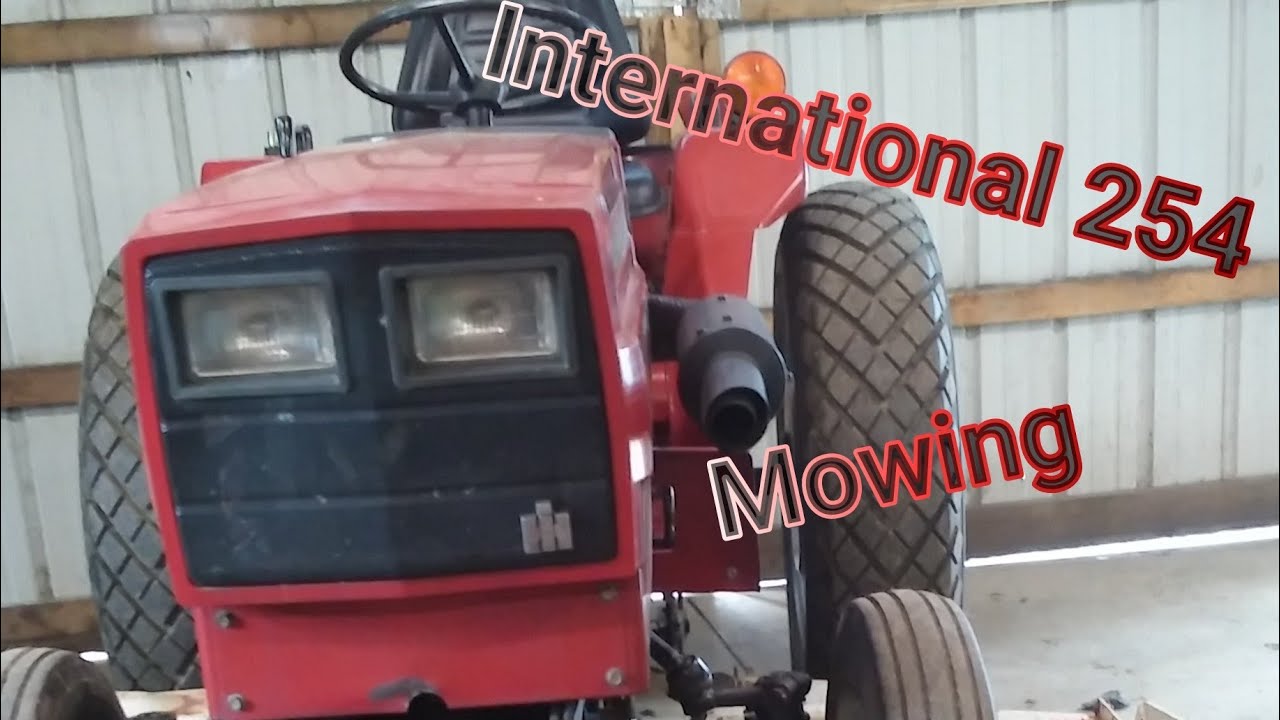 International 254 Tractor mowing with woods mower - YouTube