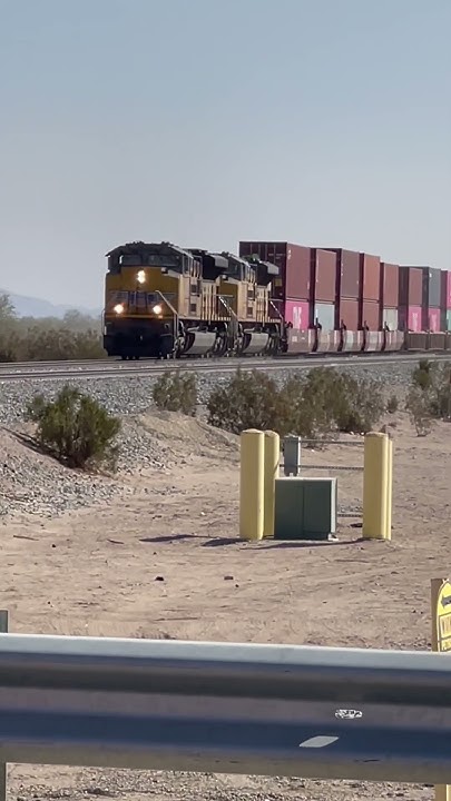 UP 9068 SD70AH intermodal train going westbound to indio at the railroad crossing - YouTube