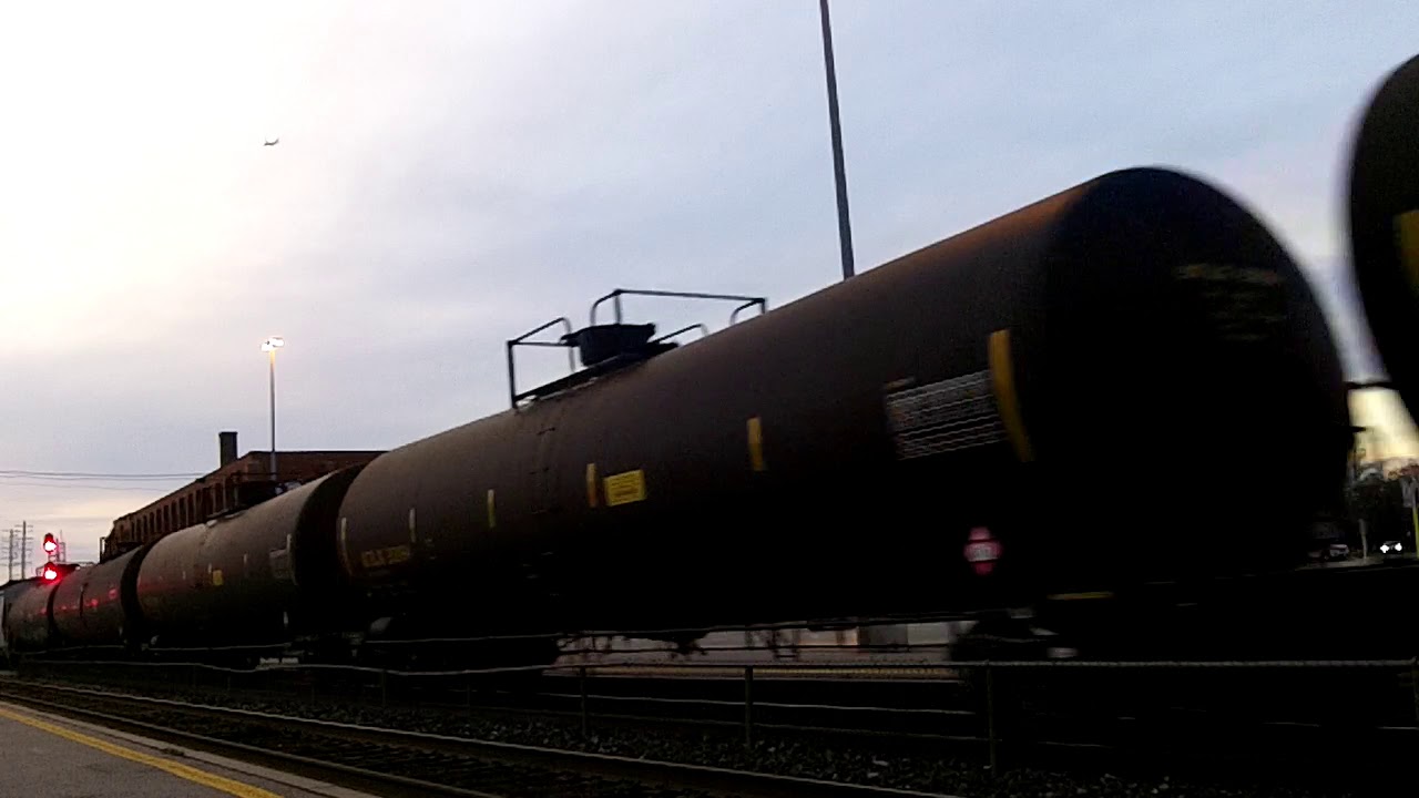 CN 394 w/ CN 5778, IC 2457 & CN 8012 lead this long 714 axle, EB Mixed ...