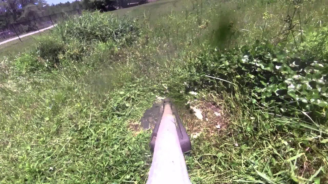 Weed whacking around the house - YouTube