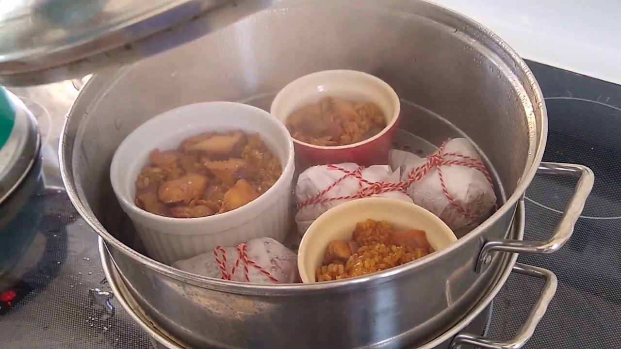 Steaming parchment paper wrapped sticky rice dumplings - YouTube