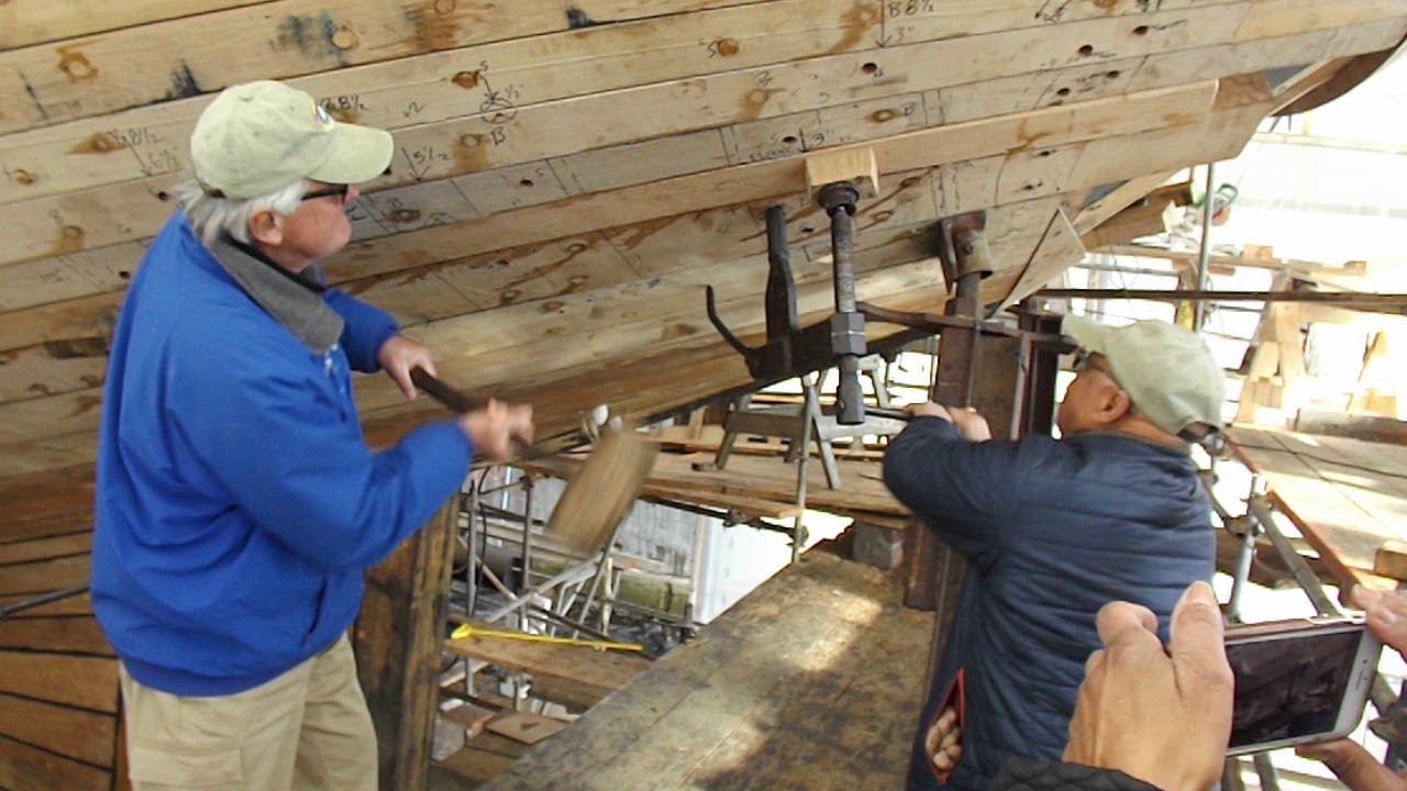 Pounding and clamping the shutter plank home. - YouTube