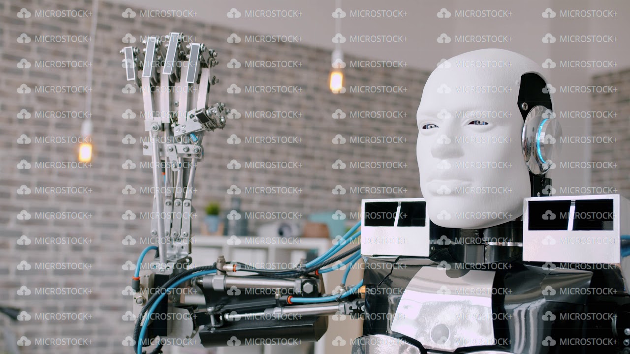 Smart automated robot moving hand making fist in office during test by ...