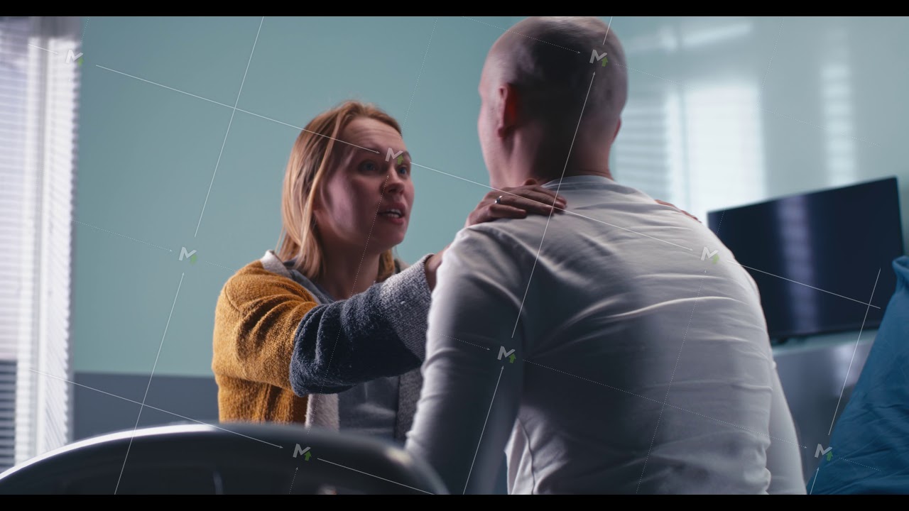 Woman supporting man in hospital ward - YouTube