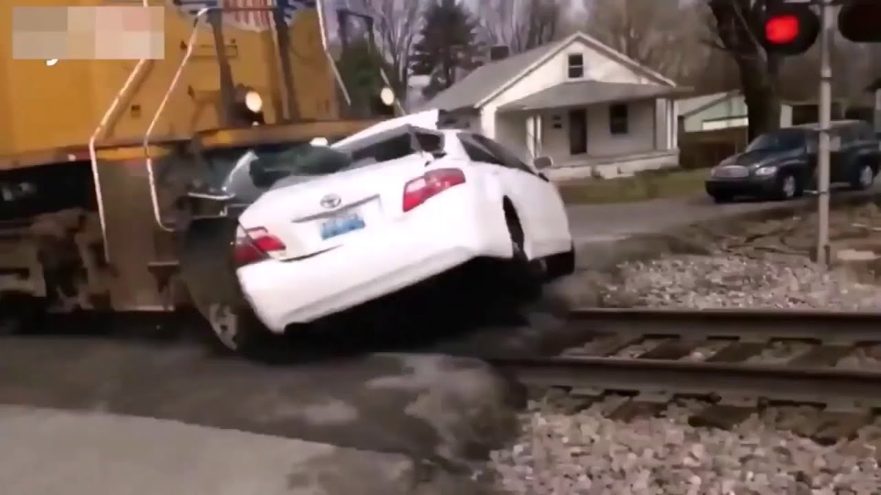 SLAPPED TRAIN # Toyota Camry crossing train tracks at a the wrong ...
