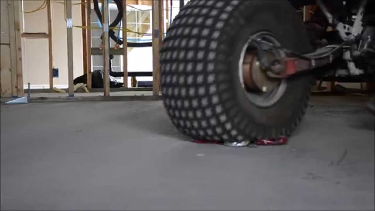 riding over cans, crushed flat under my tire on my 200XE - YouTube