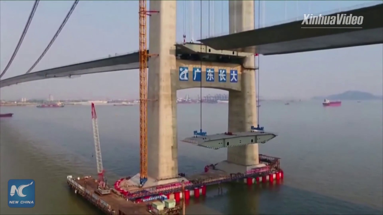 World's largest-span steel-box beam suspension bridge nears completion ...