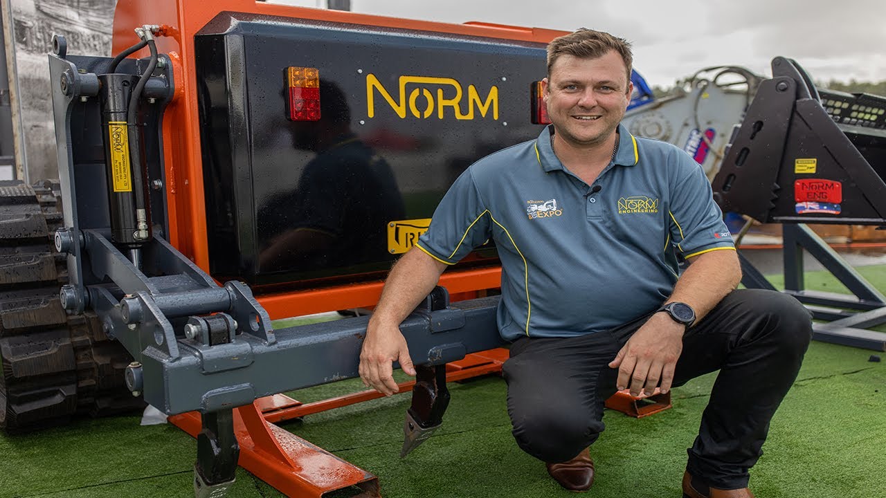 John Pesch of Norm Engineering shows their rear rippers for skid steer ...