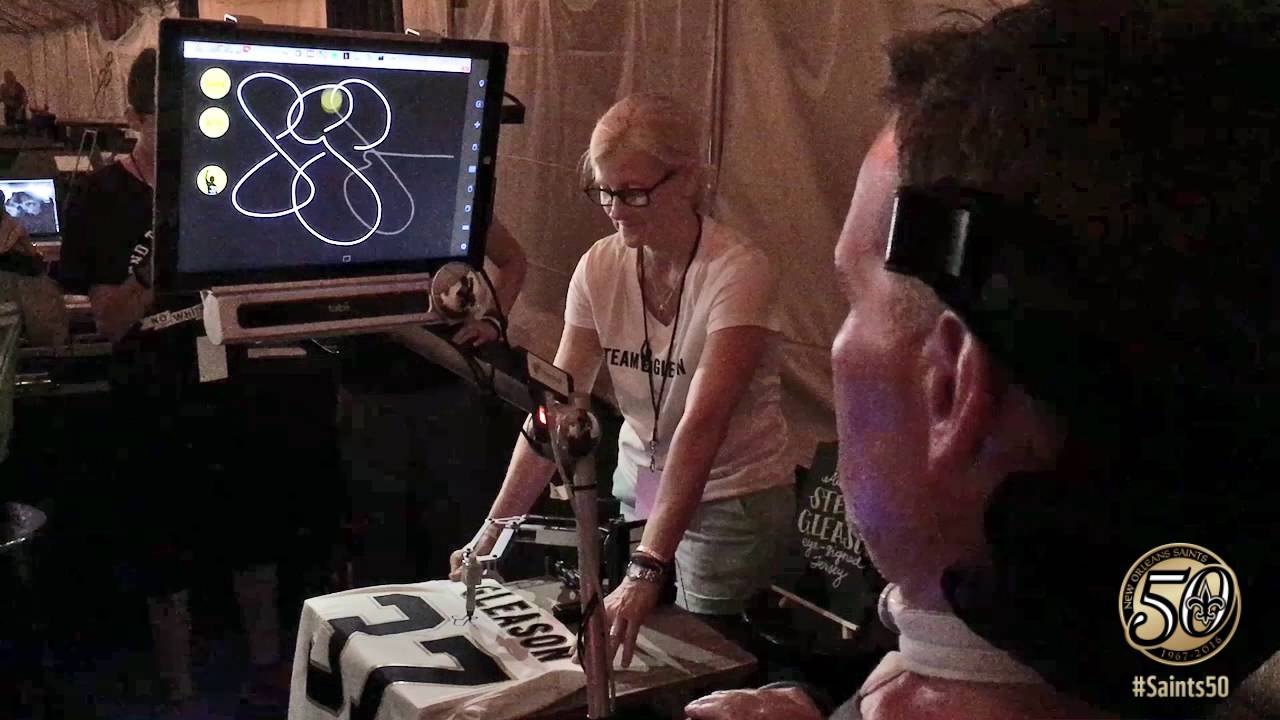 Steve Gleason autographs a jersey with his eyes - YouTube