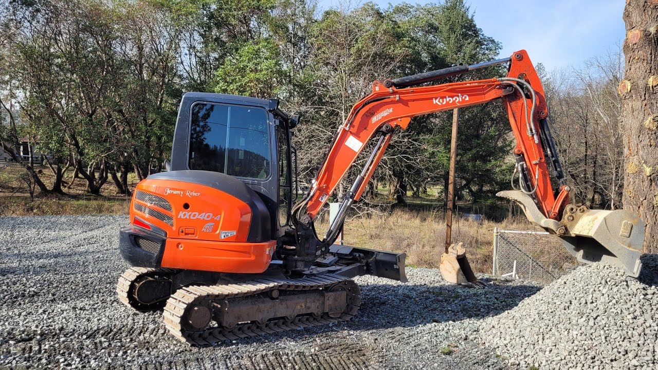 Cleanup and a little gravel with the Kubota KX-040 - YouTube