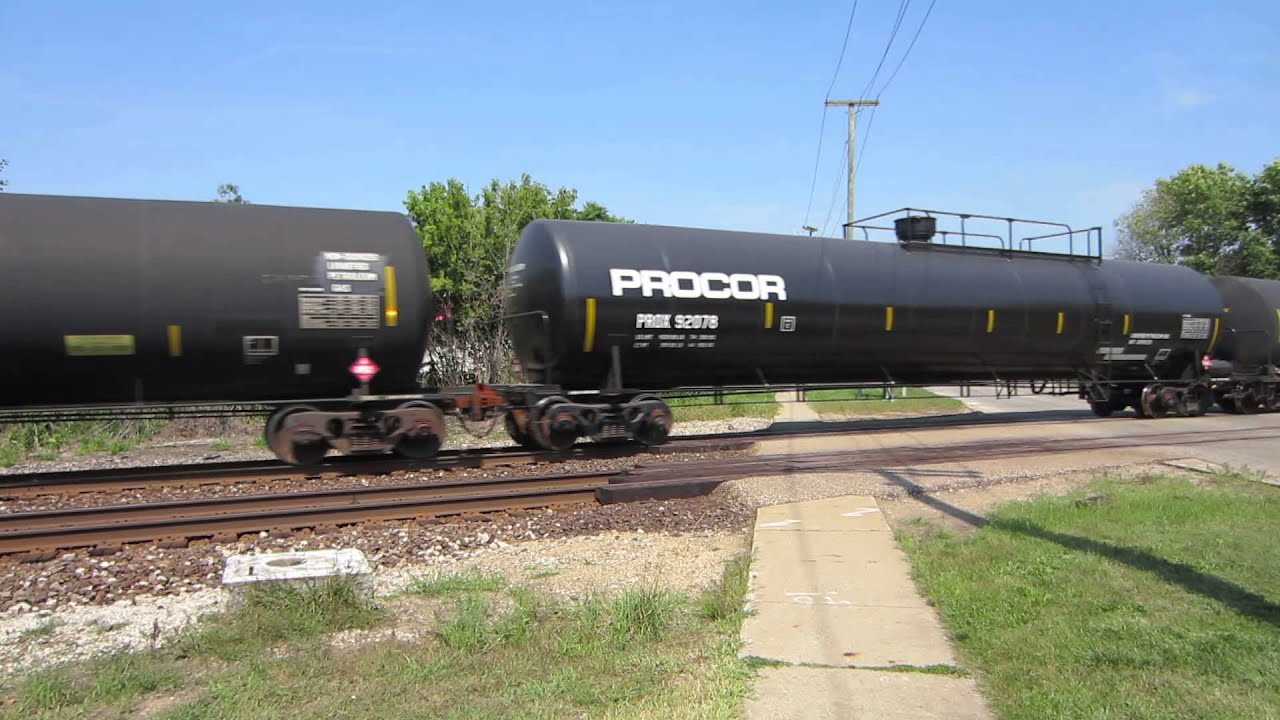 CN 2563, GMTX 151 EMD SW1500 switcher, and old red stripe PROCOR tank ...