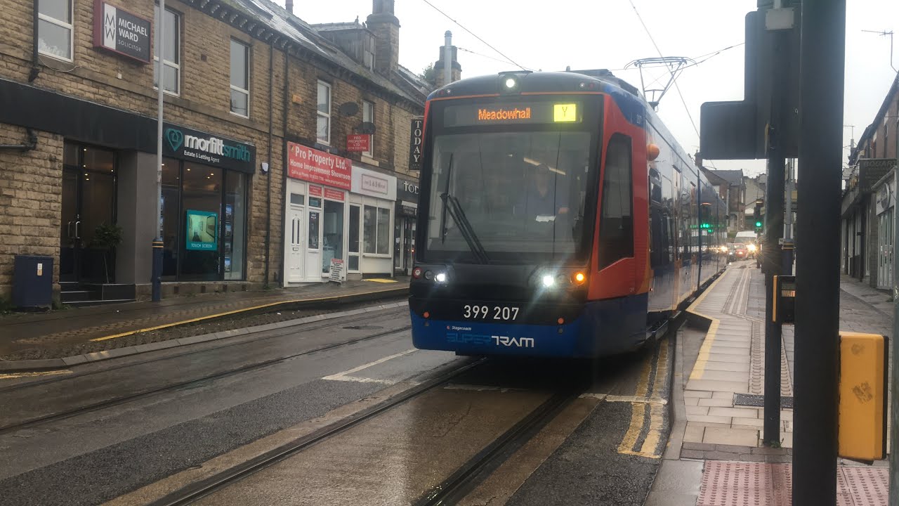 Sheffield Tram-Train 399 207 departs Hillsborough Park with a Yellow ...