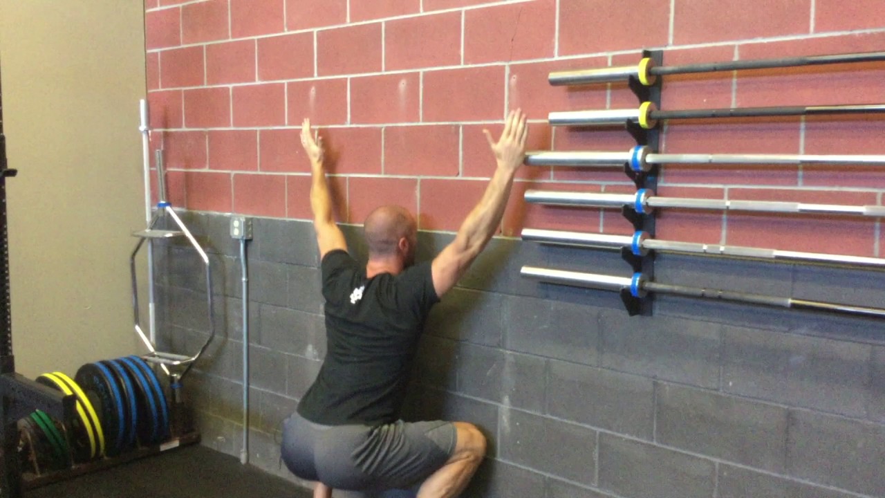 Facing the Wall Squat | Minute Move Well Snack - YouTube