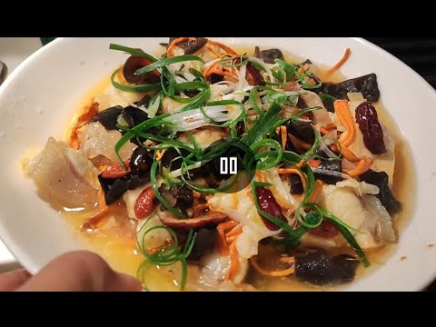 Sliced fish, garopa fillet 'steam garnish with springonions,splash in ...