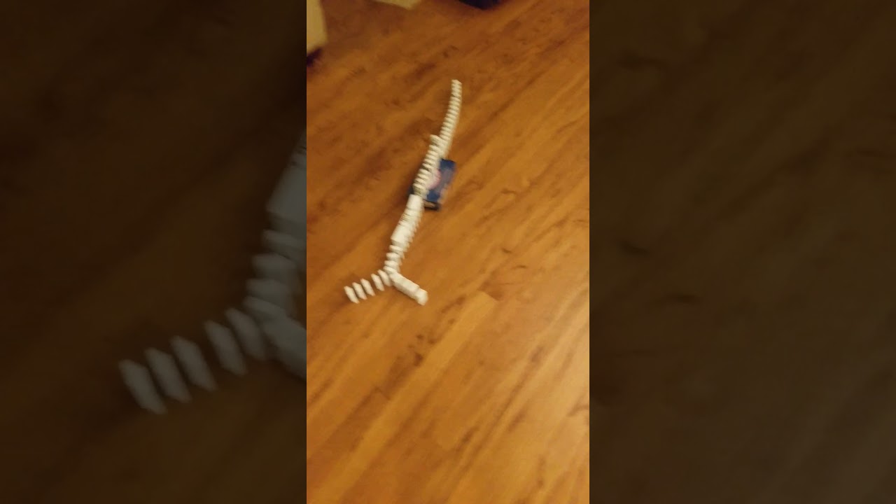 knocking down dominoes - YouTube