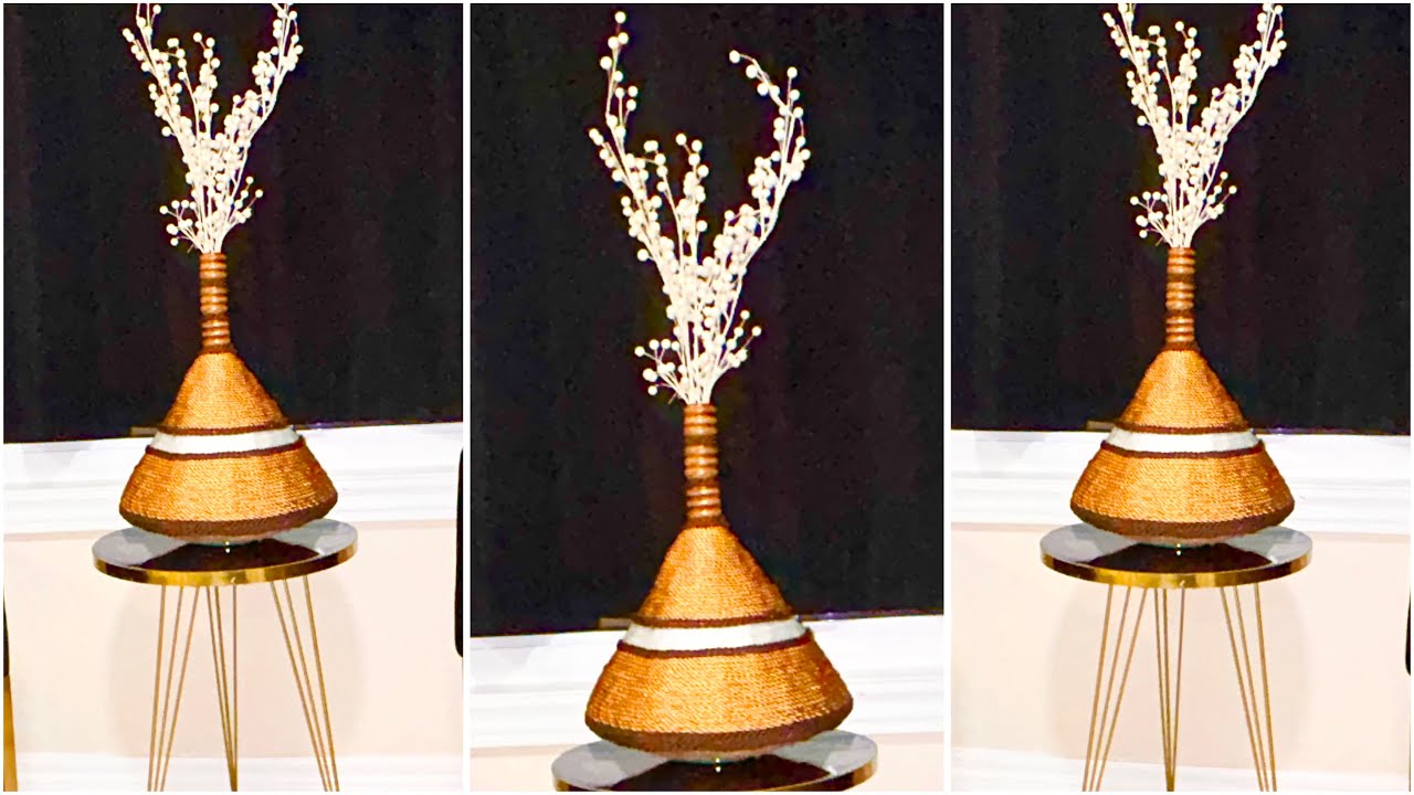 A Pyramid flower Vase that I made out of recycled materials and ropes ...