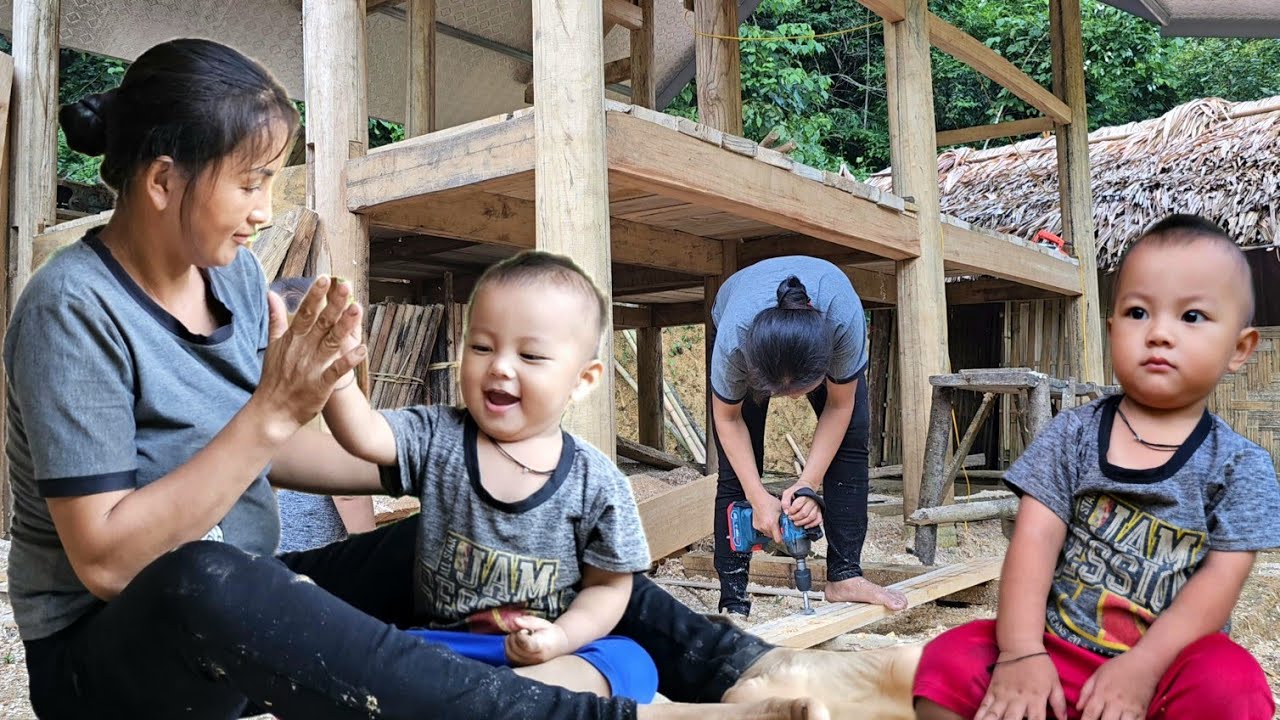 Building, making house walls, the small dream house of a poor mother ...