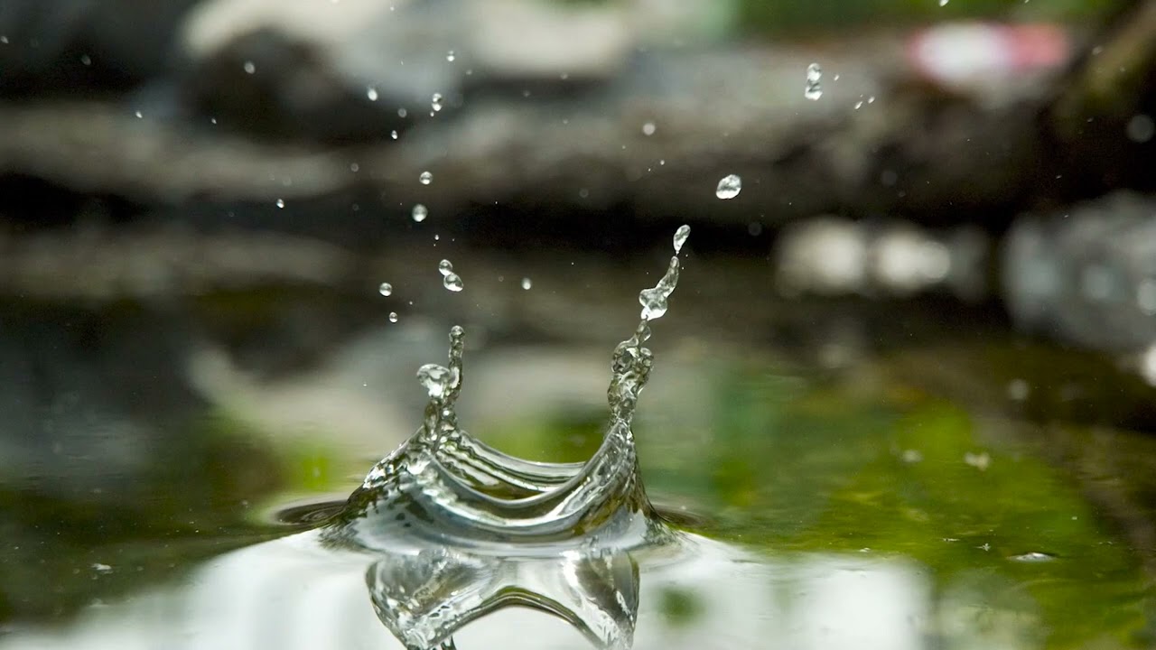 rock splash on water - YouTube