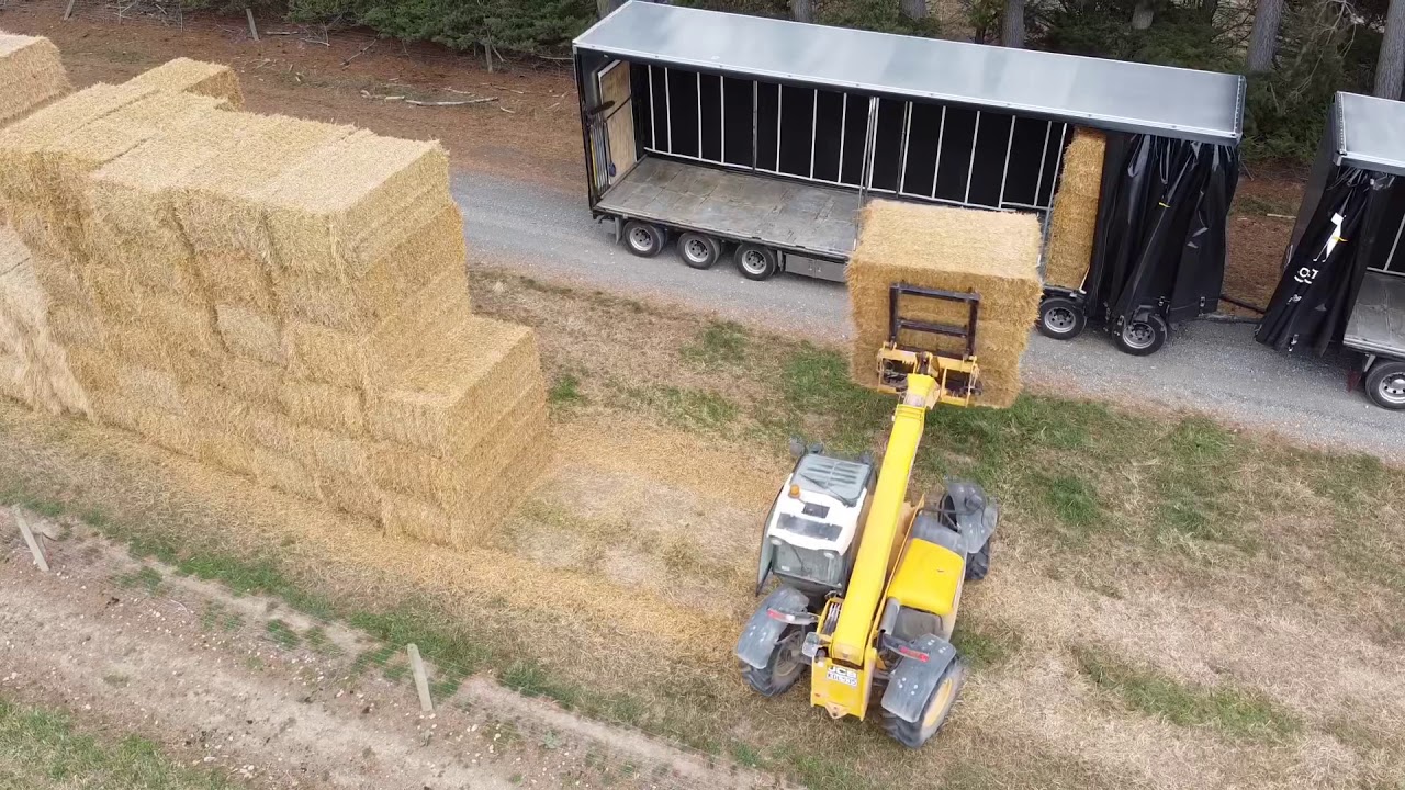 Loading Bales with a JCB Loader - YouTube