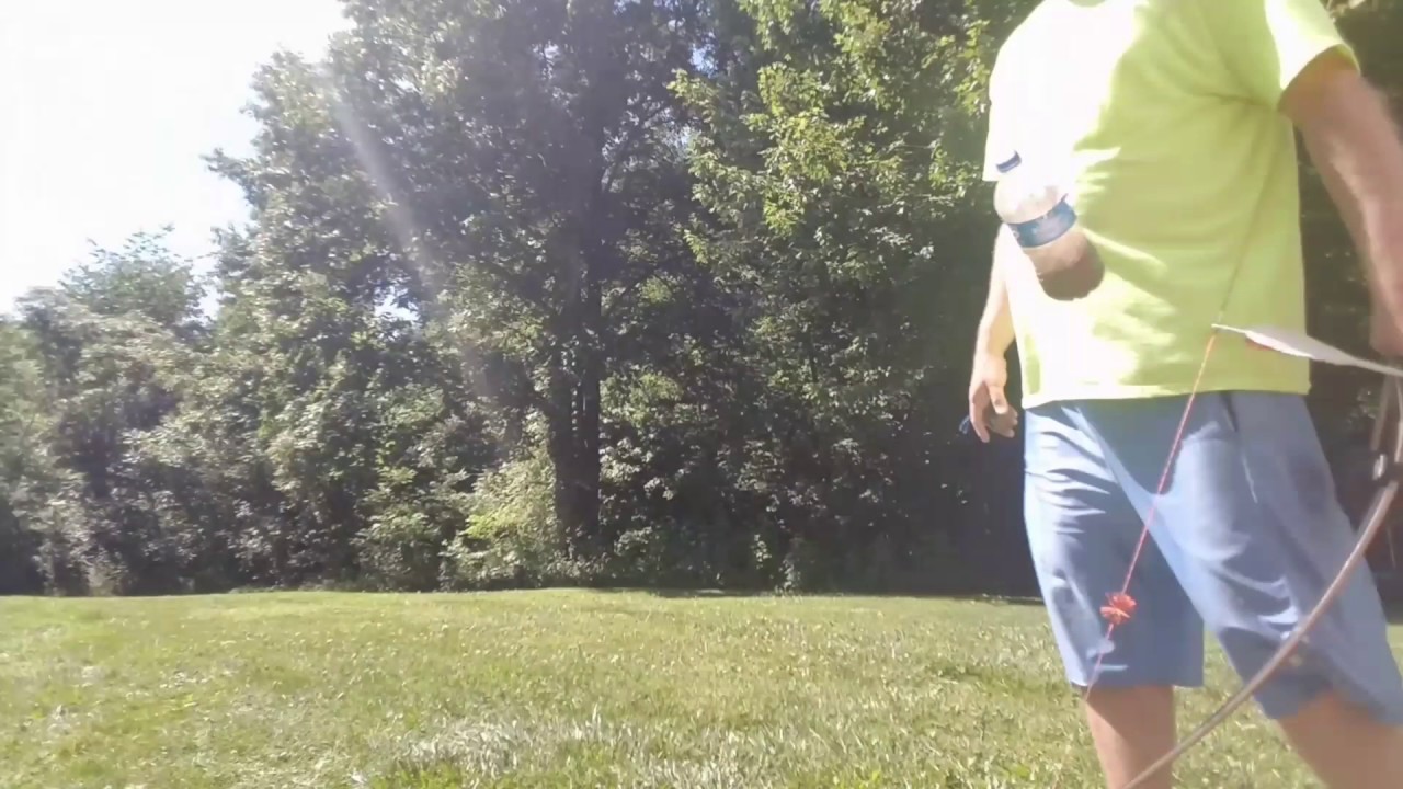 Instinctive archery trick shot- double swinging bottles - YouTube