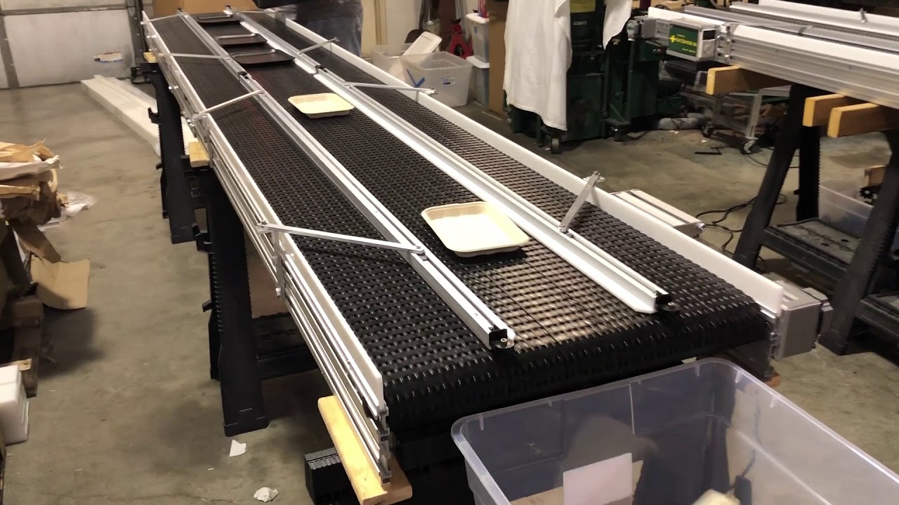 Moving Trays with Safe Conveyor, Inc. using adjustable custom guide ...