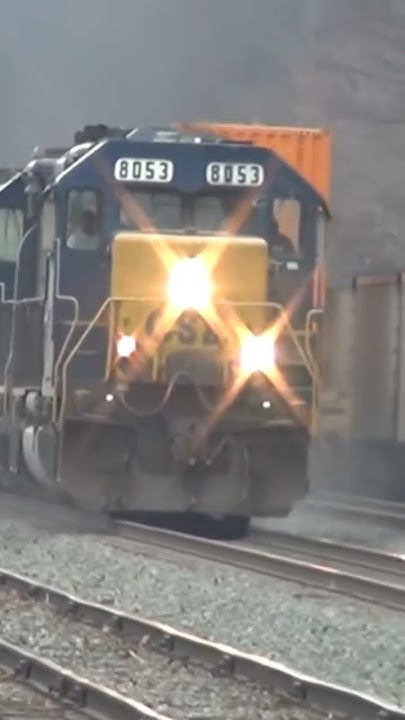 Pair of CSX SD40-2 engines Chug past CP freight train. - YouTube